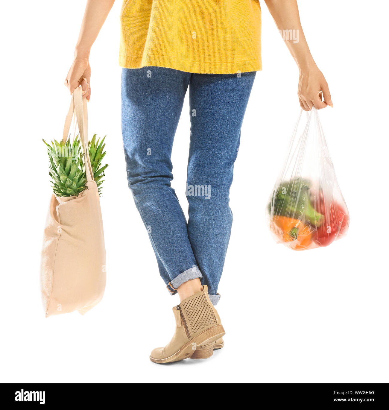 Woman carrying plastic bags hi-res stock photography and images - Alamy