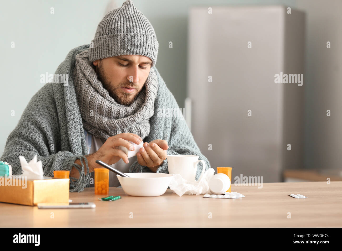 Sick man with chicken soup hi-res stock photography and images - Alamy