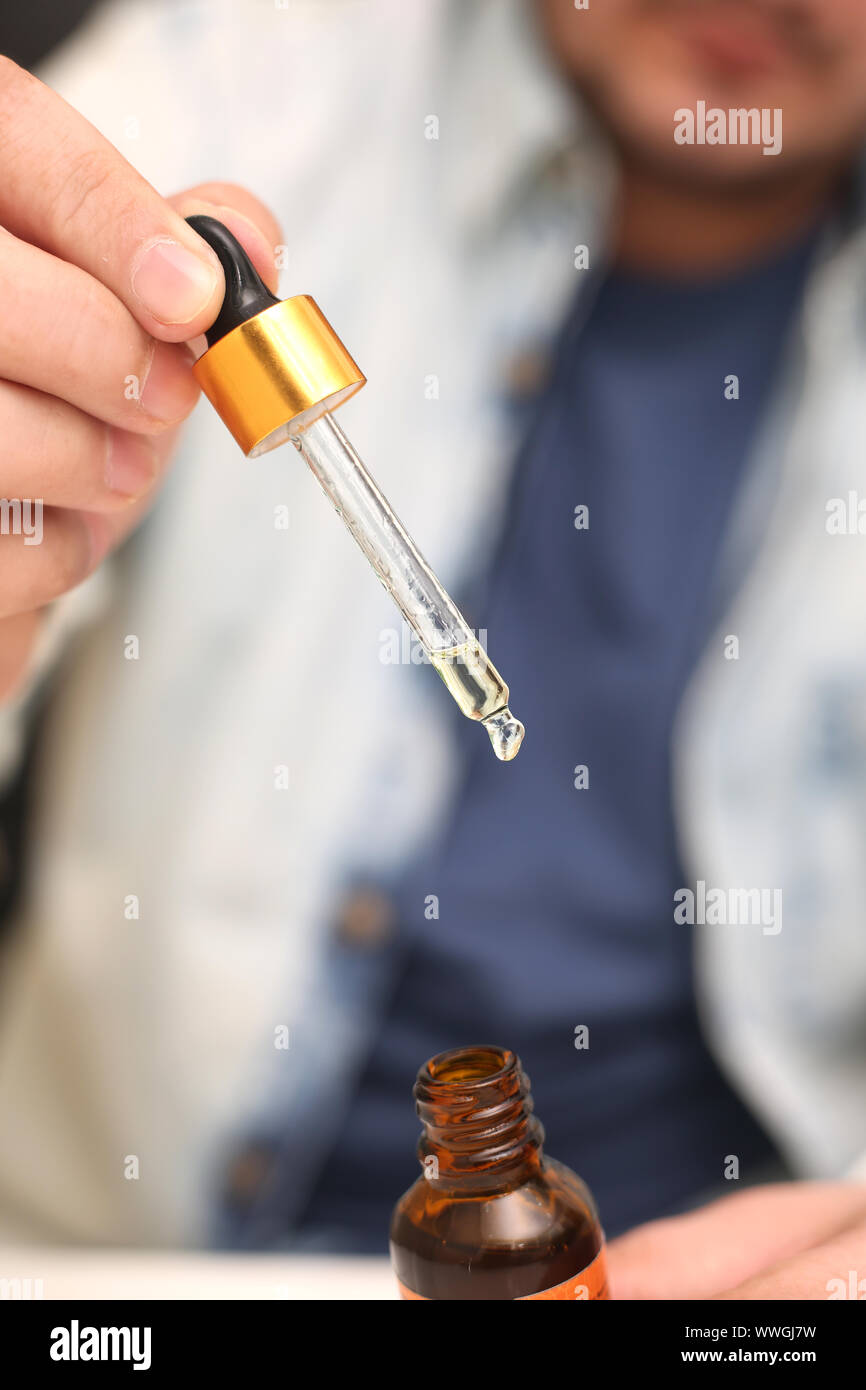 Picture of man drops medicine bottle holding in hand. Isolated on white ...