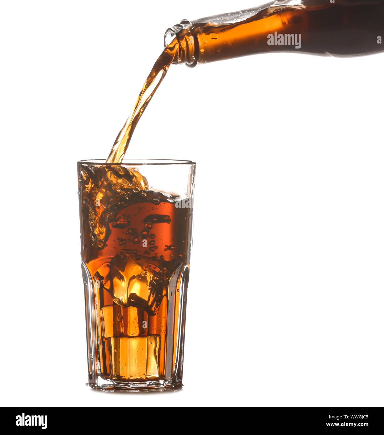 Pouring of cold cola into glass on white background Stock Photo - Alamy