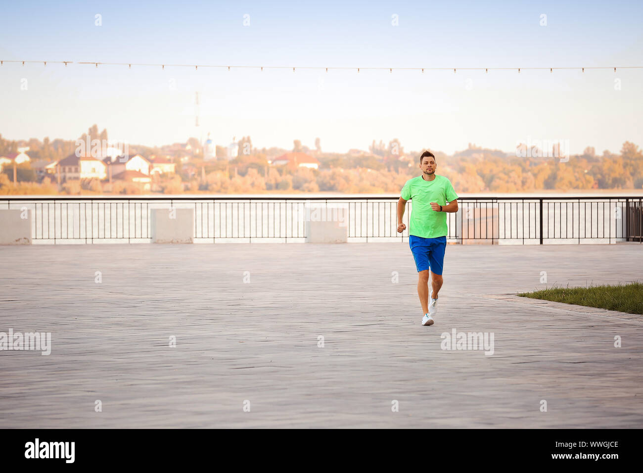 Handsome sporty man running hi-res stock photography and images - Alamy