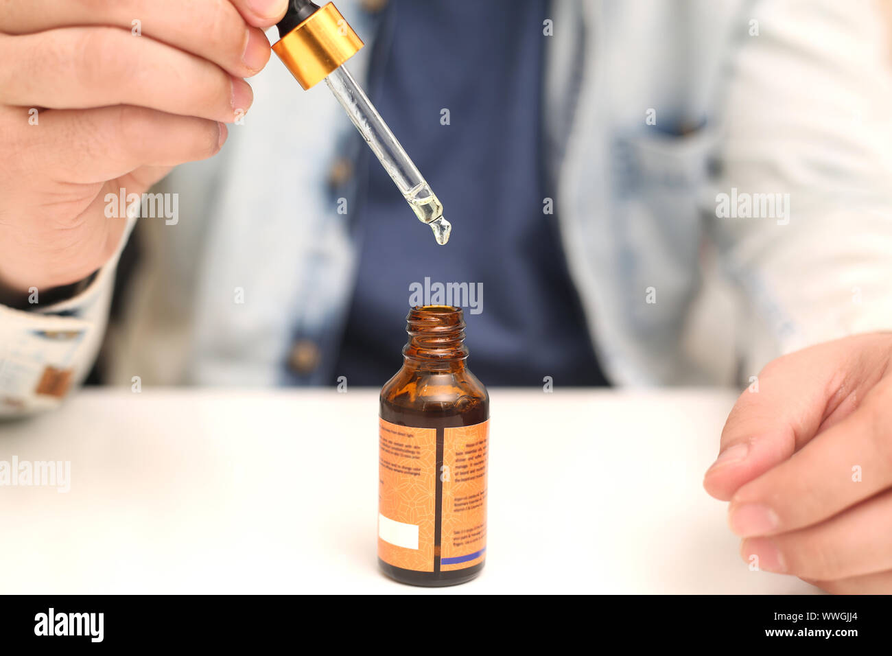 Picture of man drops medicine bottle holding in hand. Isolated on white ...
