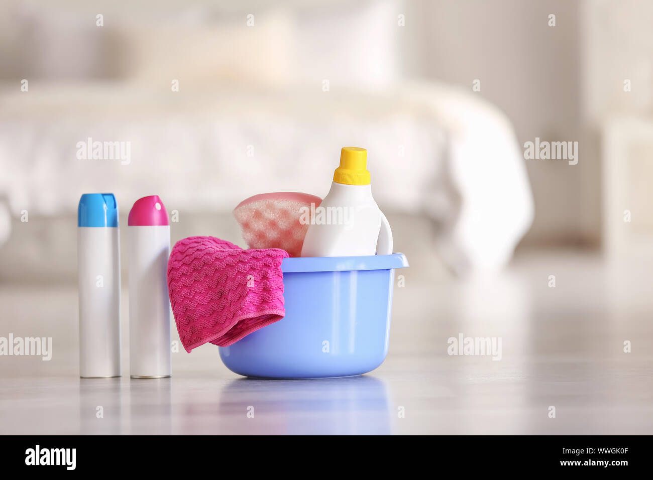 Set of cleaning supplies on floor in room Stock Photo - Alamy