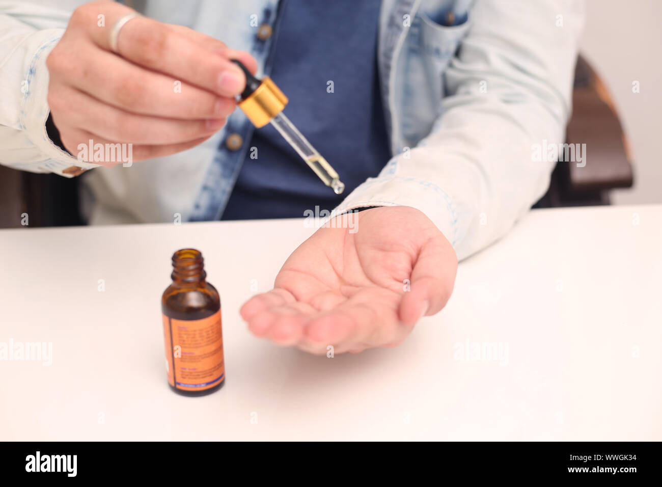 Picture of man drops medicine bottle holding in hand. Isolated on white ...
