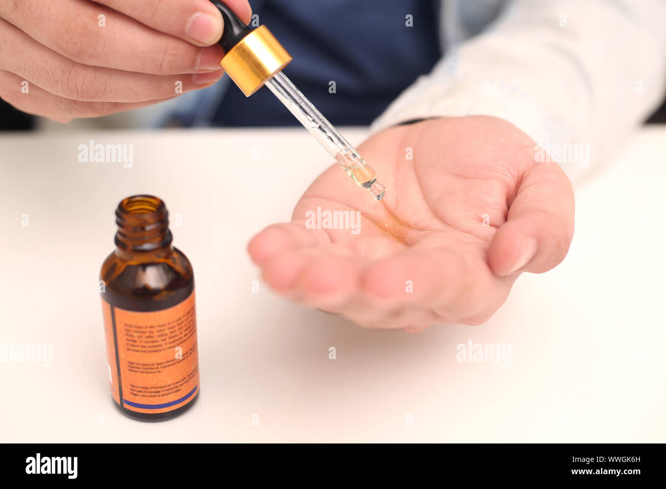 Picture of man drops medicine bottle holding in hand. Isolated on white ...