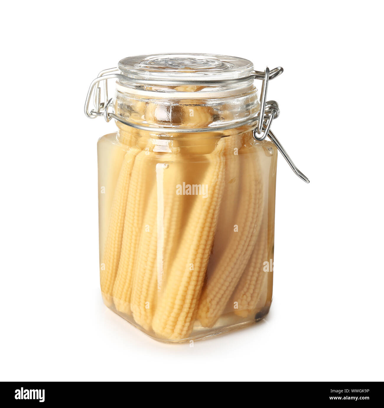Jar with canned corn cobs on white background Stock Photo - Alamy