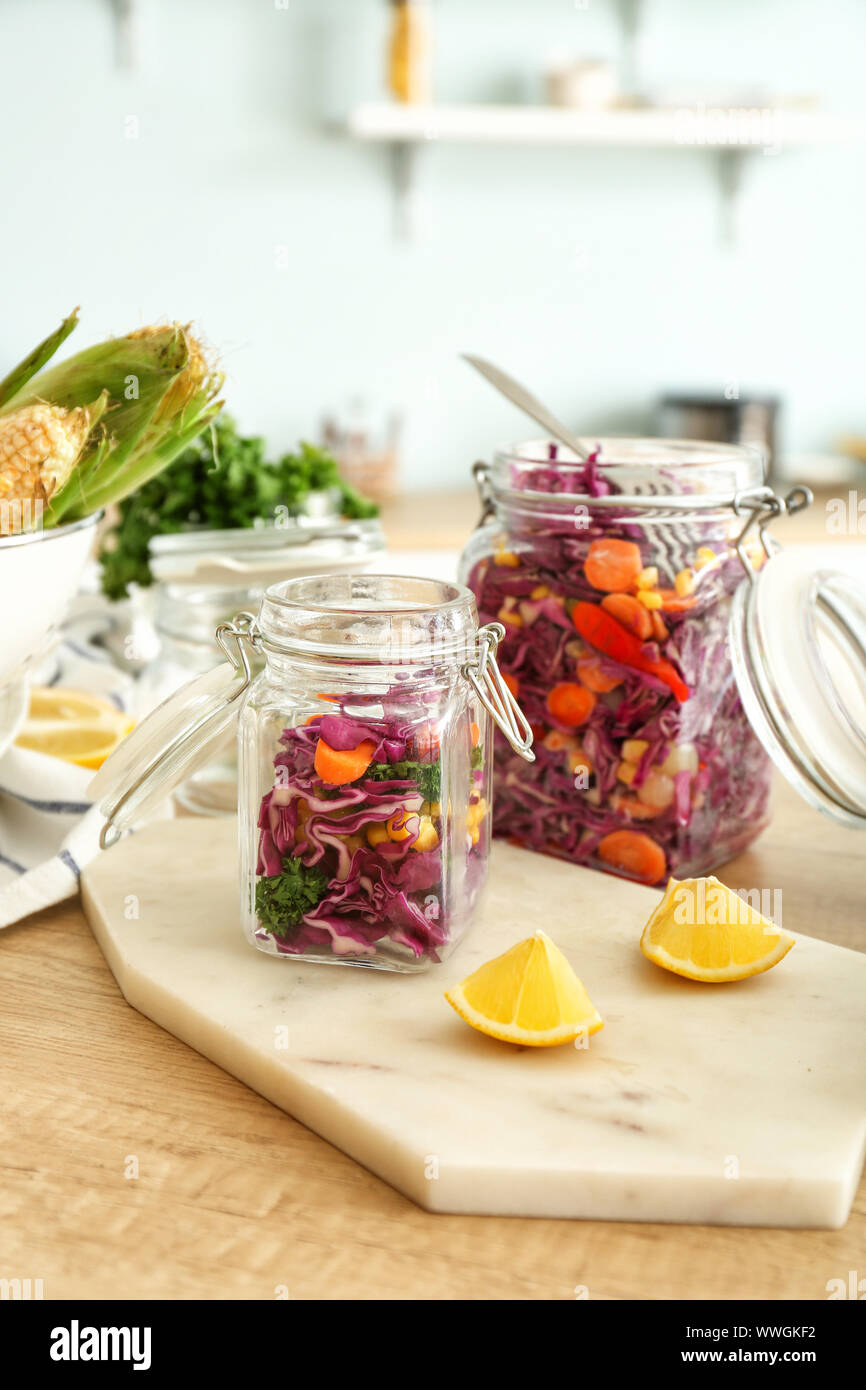 Jars with vegetables prepared for fermentation on table Stock Photo - Alamy