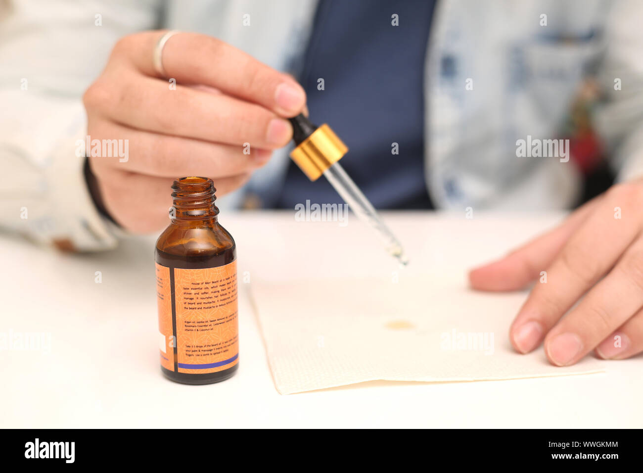 Picture of man drops medicine bottle holding in hand. Isolated on white ...