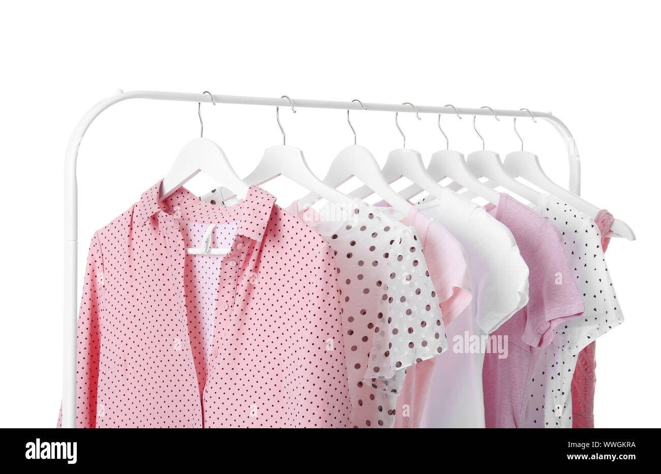 Rack with hanging clothes on white background Stock Photo - Alamy