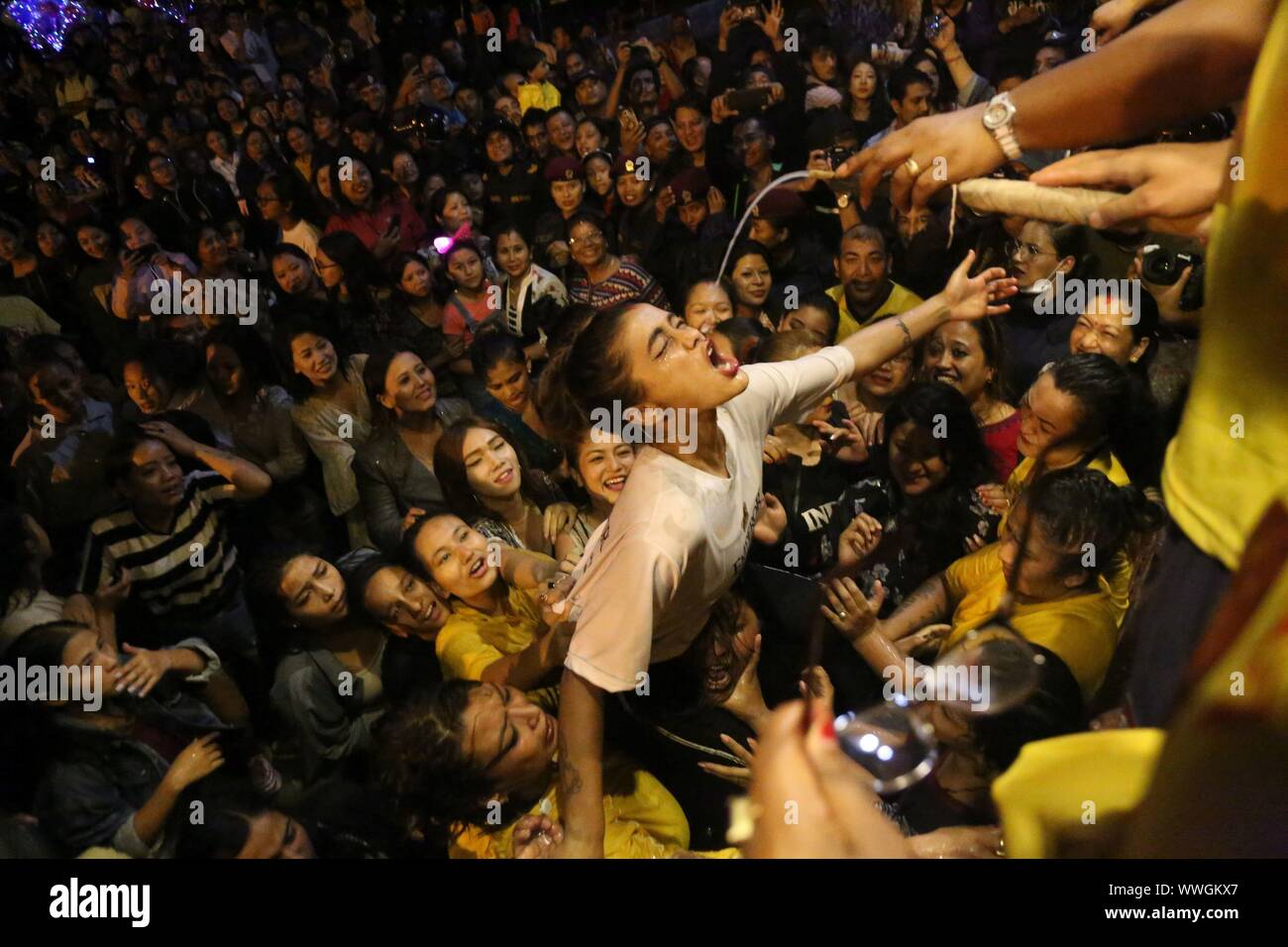 Kathmandu, Nepal. 15th Sep, 2019. Nepalese women struggle to drink ...