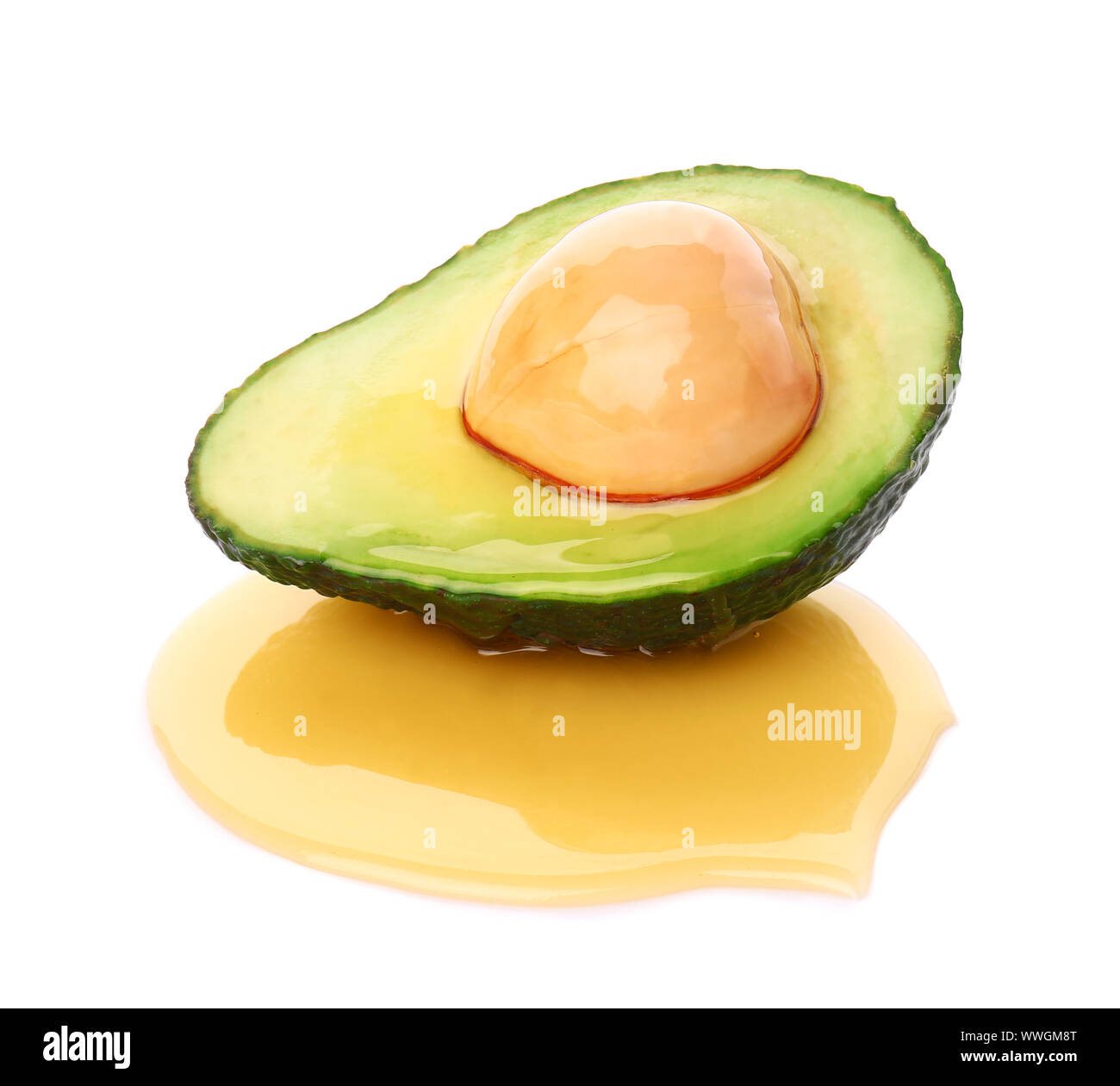 Half of ripe avocado with honey on white background Stock Photo - Alamy