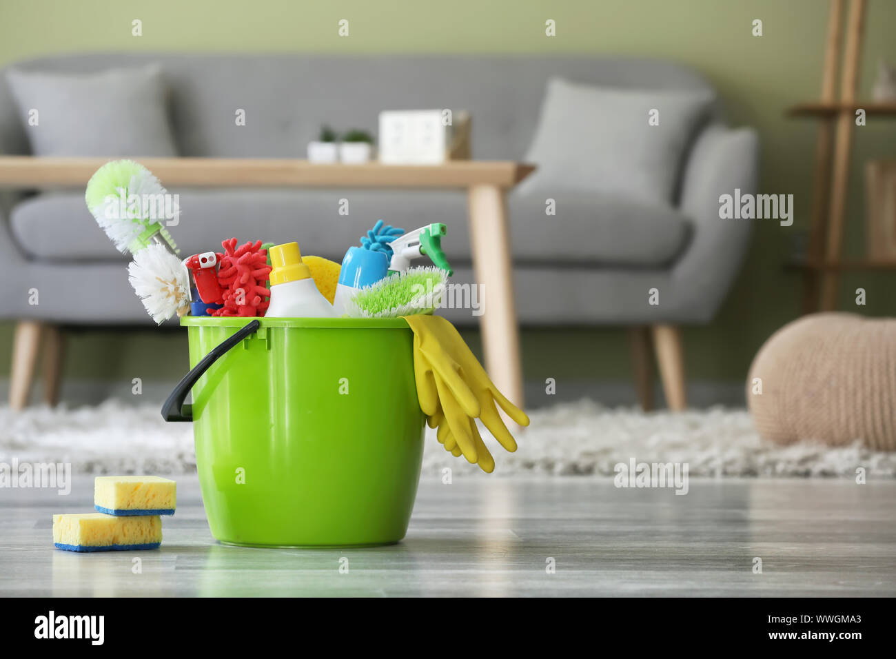 Set of cleaning supplies in room Stock Photo - Alamy