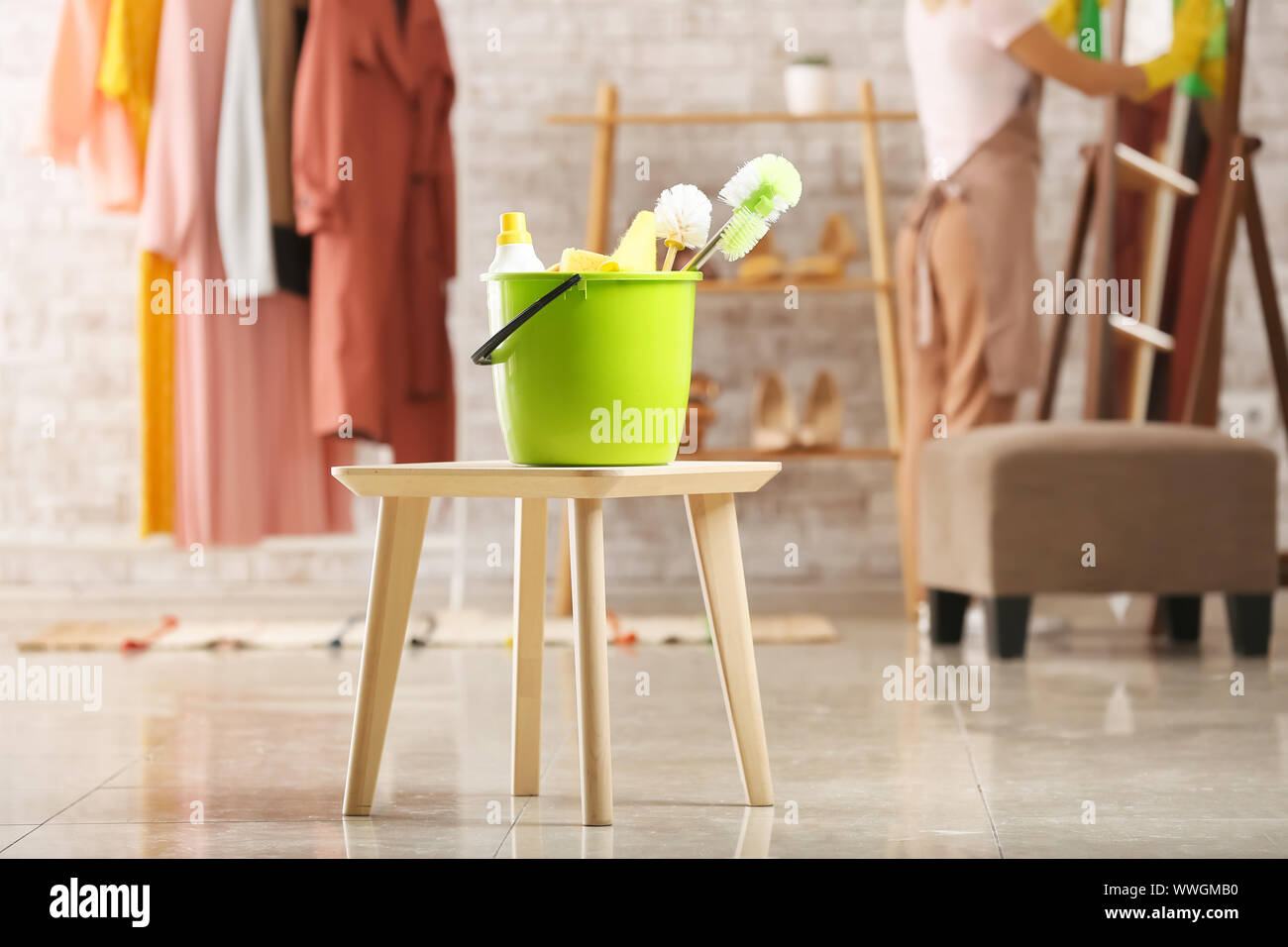 Set of cleaning supplies in room Stock Photo - Alamy