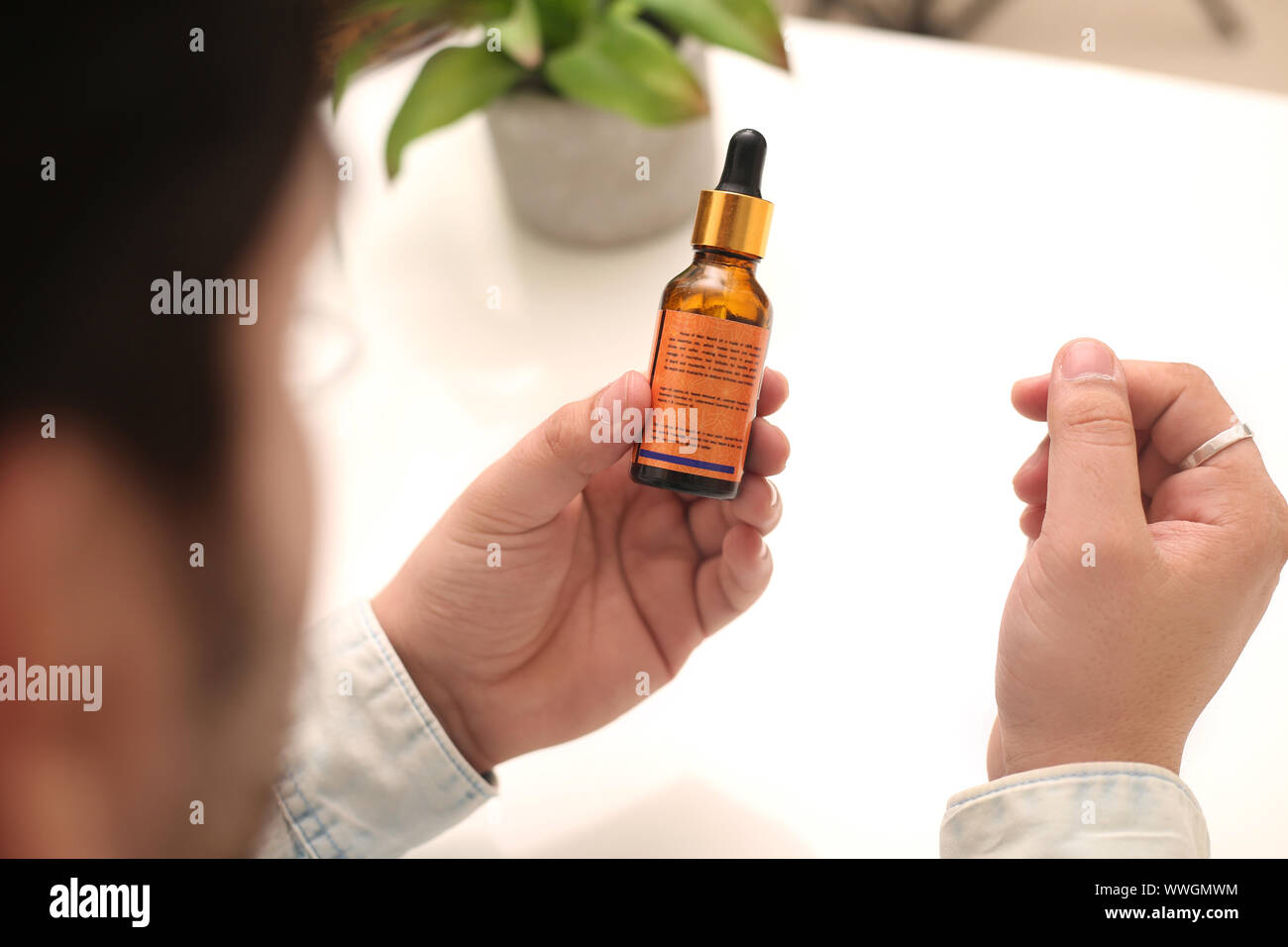 Picture of man drop medicine bottle holding in hand. Isolated on white ...