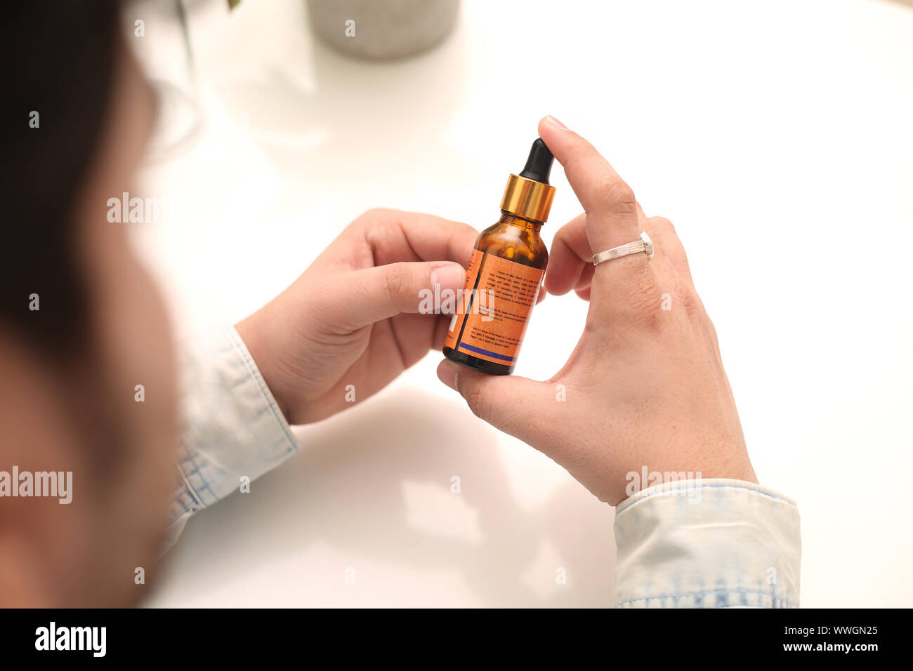 Picture of man drop medicine bottle holding in hand. Isolated on white ...