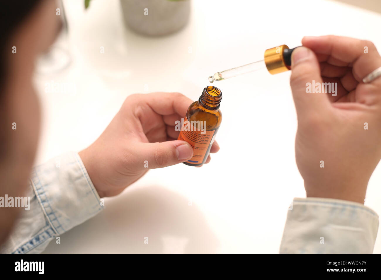 Picture of man drop medicine bottle holding in hand. Isolated on white ...