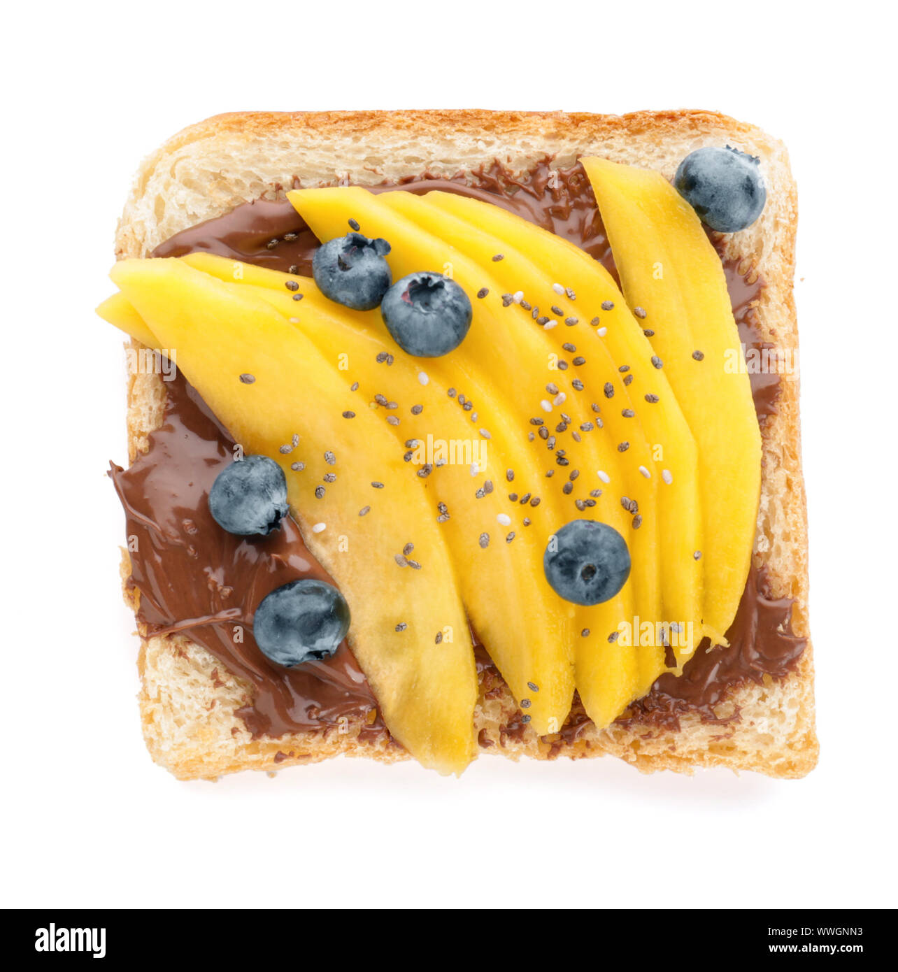 Tasty toasted bread with fruits and chocolate paste on white background ...