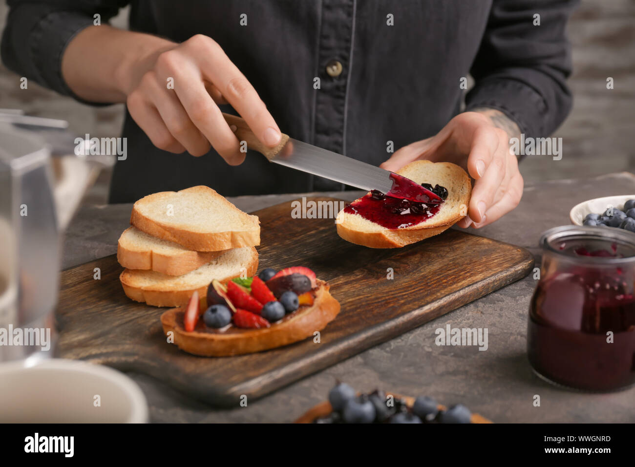 Hands female spreading jam toast hi-res stock photography and images ...
