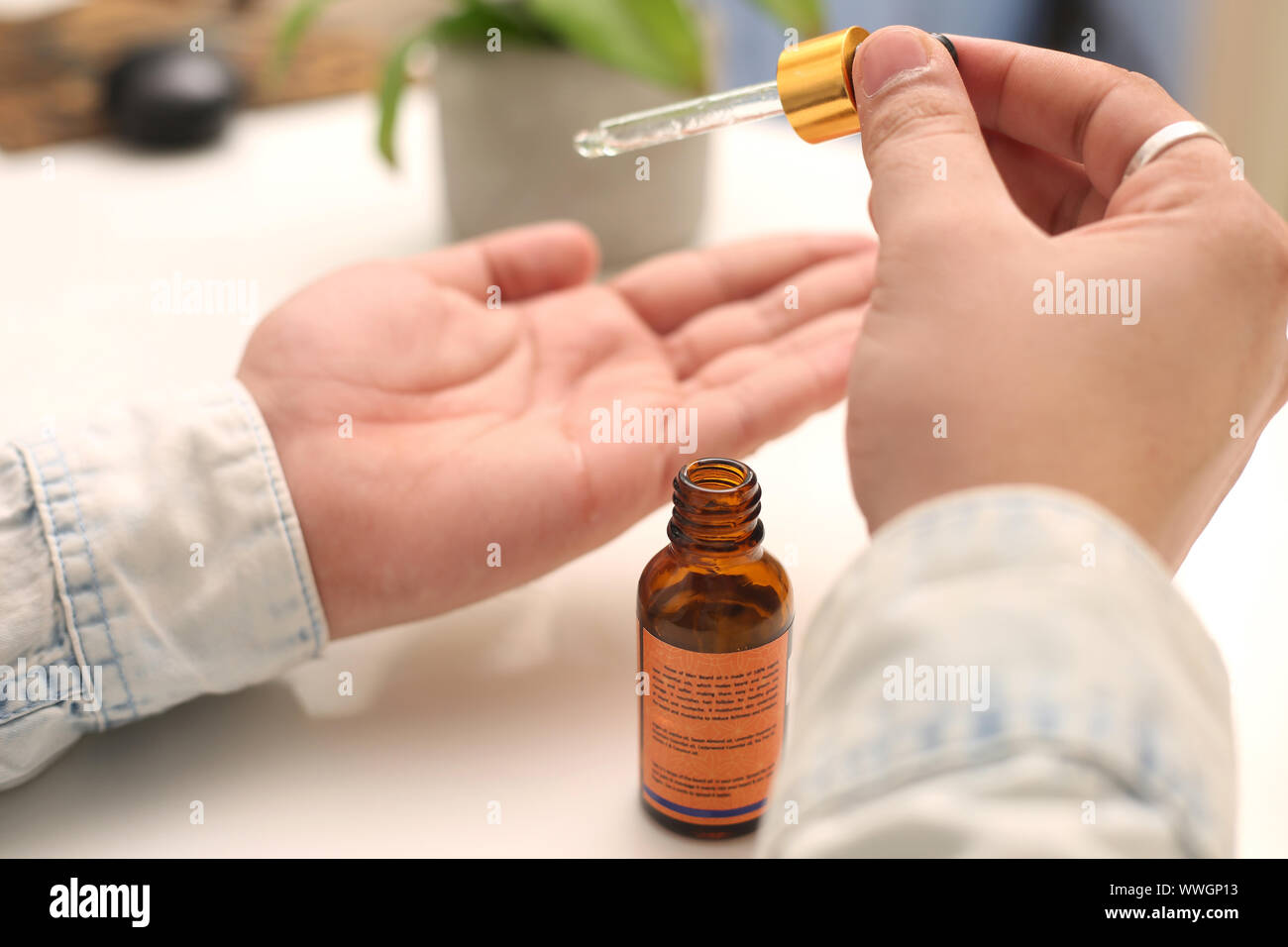 Picture of man drop medicine bottle holding in hand. Isolated on white ...