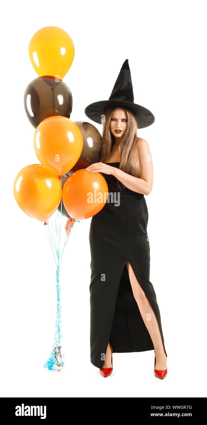 Beautiful woman dressed as witch for Halloween on white background ...