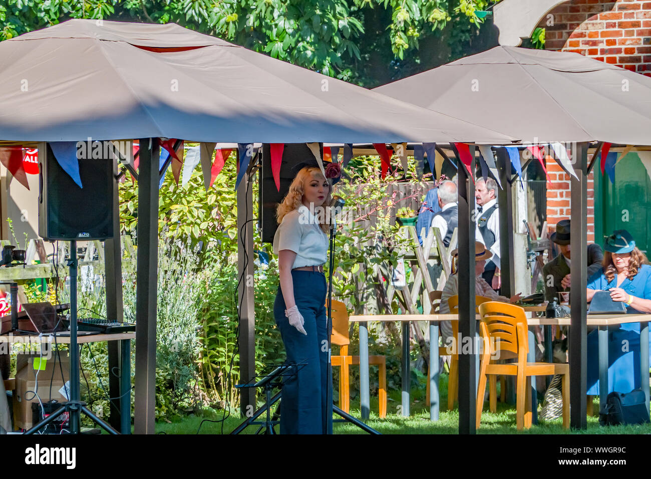 Female singer performing on Holt train station during the annual ...