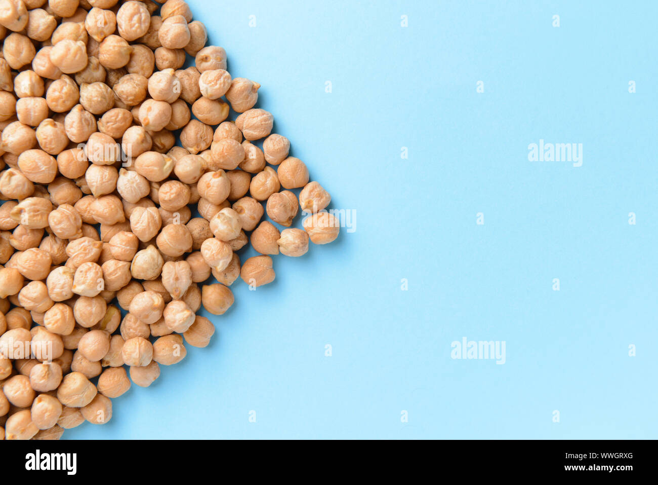 Raw chickpea on color background Stock Photo - Alamy