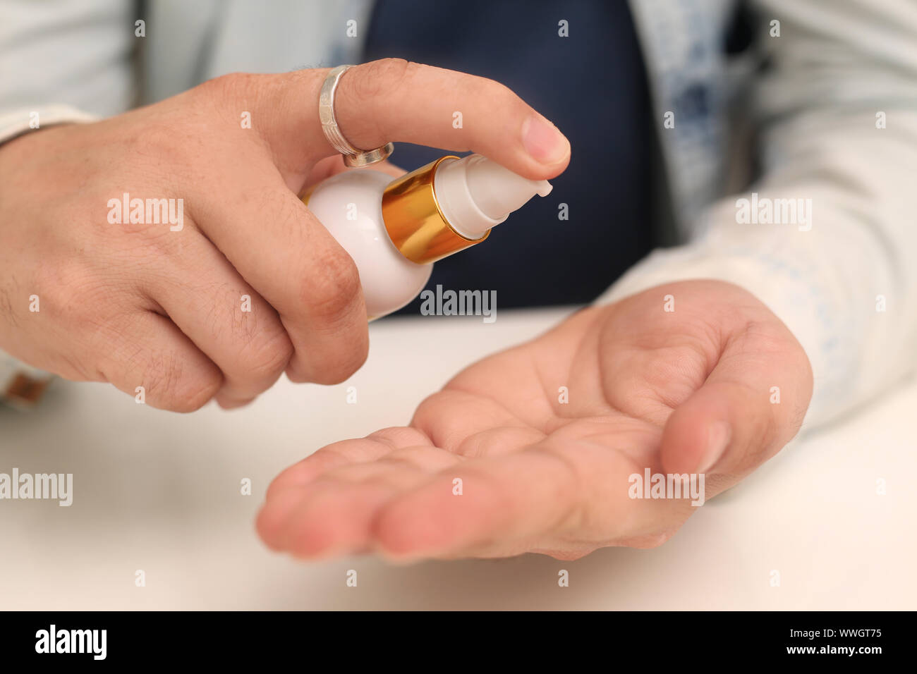 Picture of man spray medicine bottle holding in hand. Isolated on a ...