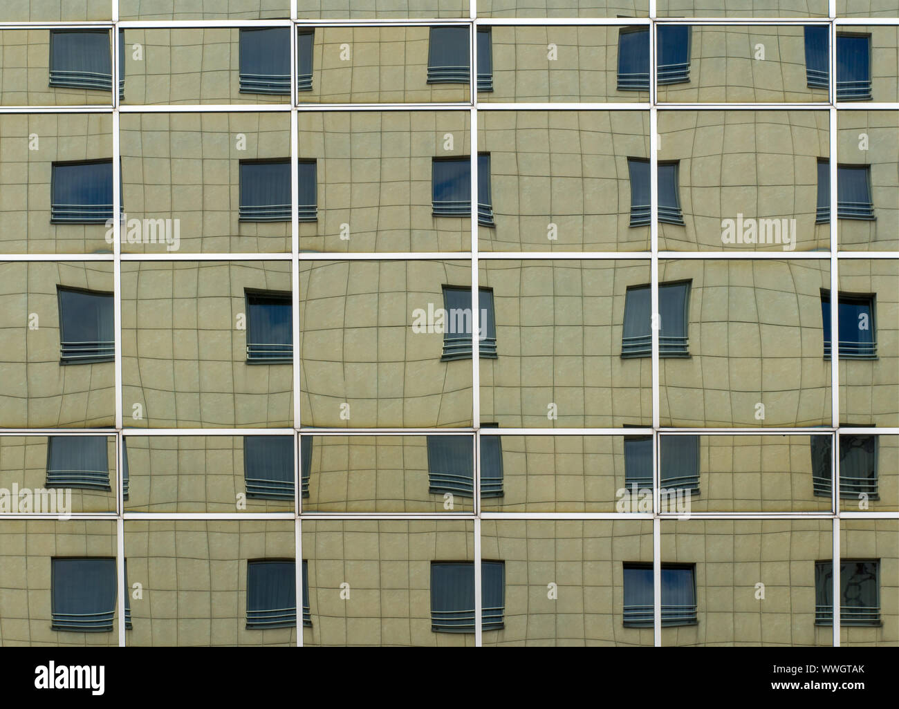 Mirror reflection of the facade of a multi-storey building in large ...