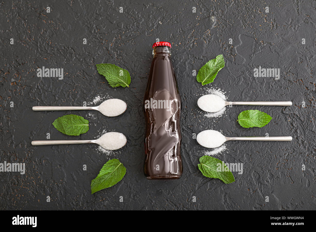 Composition with bottle of cola and sugar on dark background Stock ...