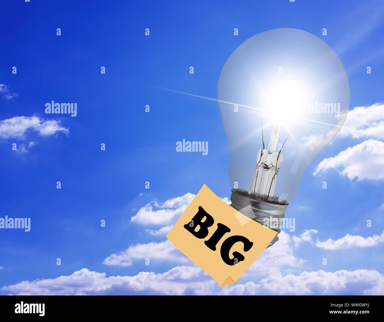 Think big concept, light bulb fly on blue sky background Stock Photo ...