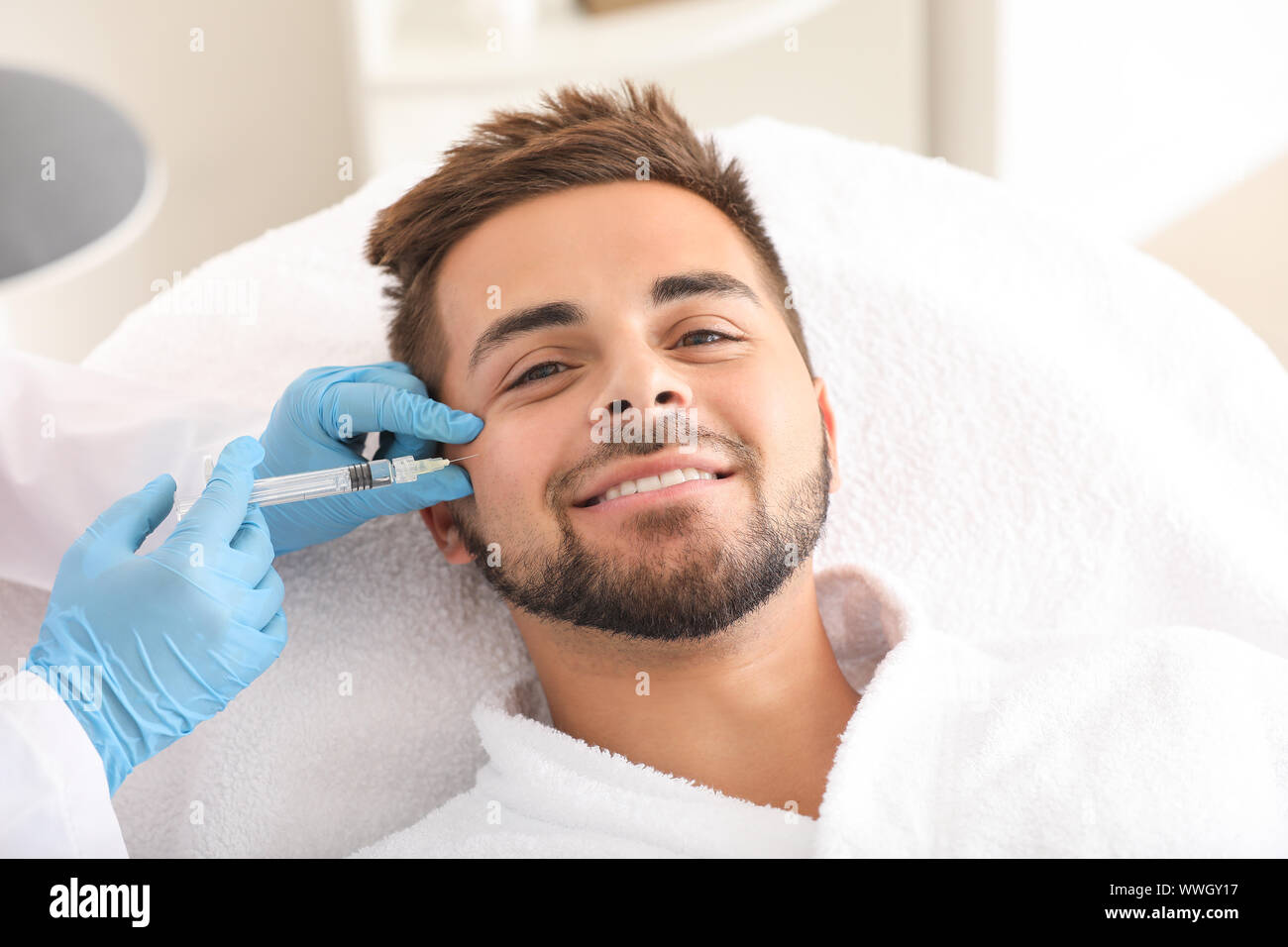Man receiving botox injection hi-res stock photography and images - Alamy