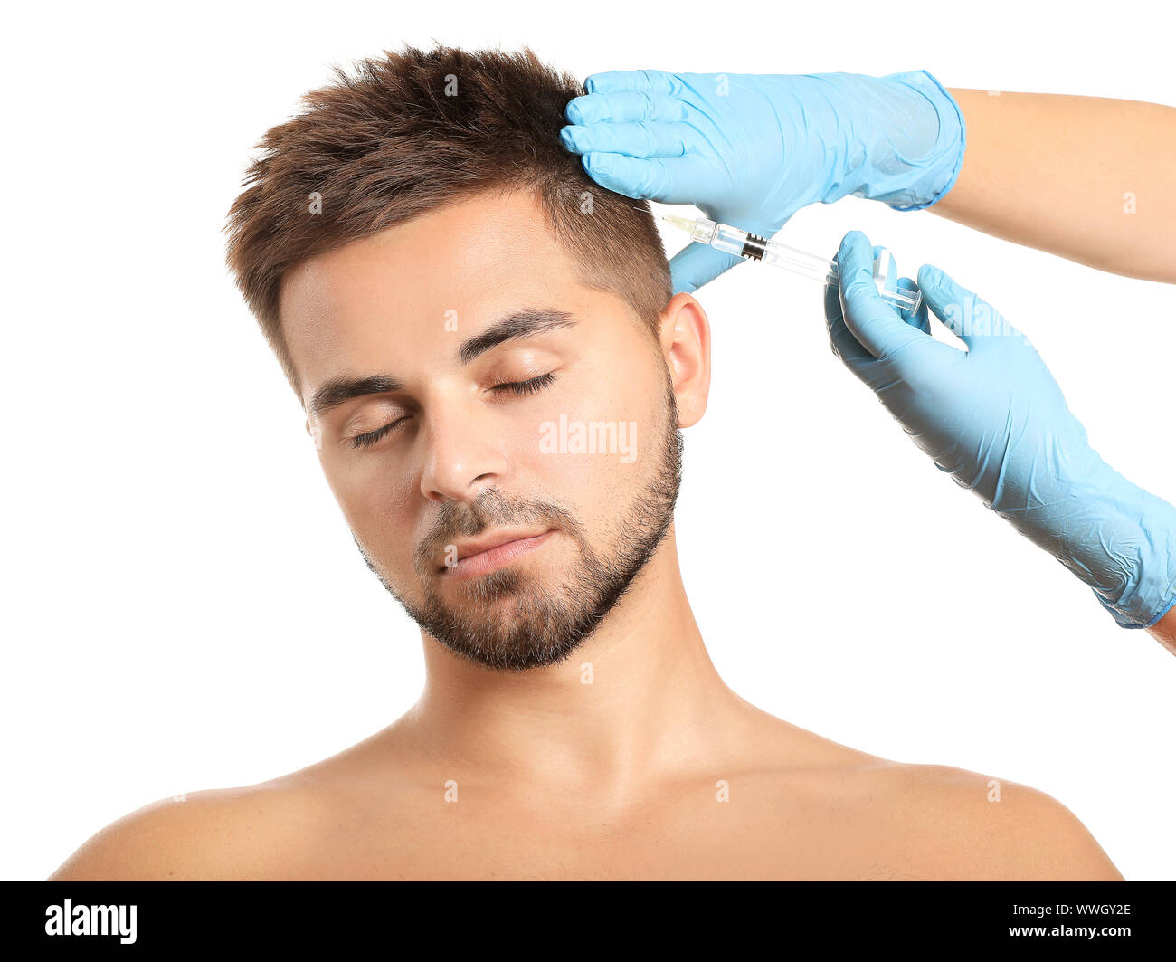 Man with hair loss problem receiving injection on white background ...