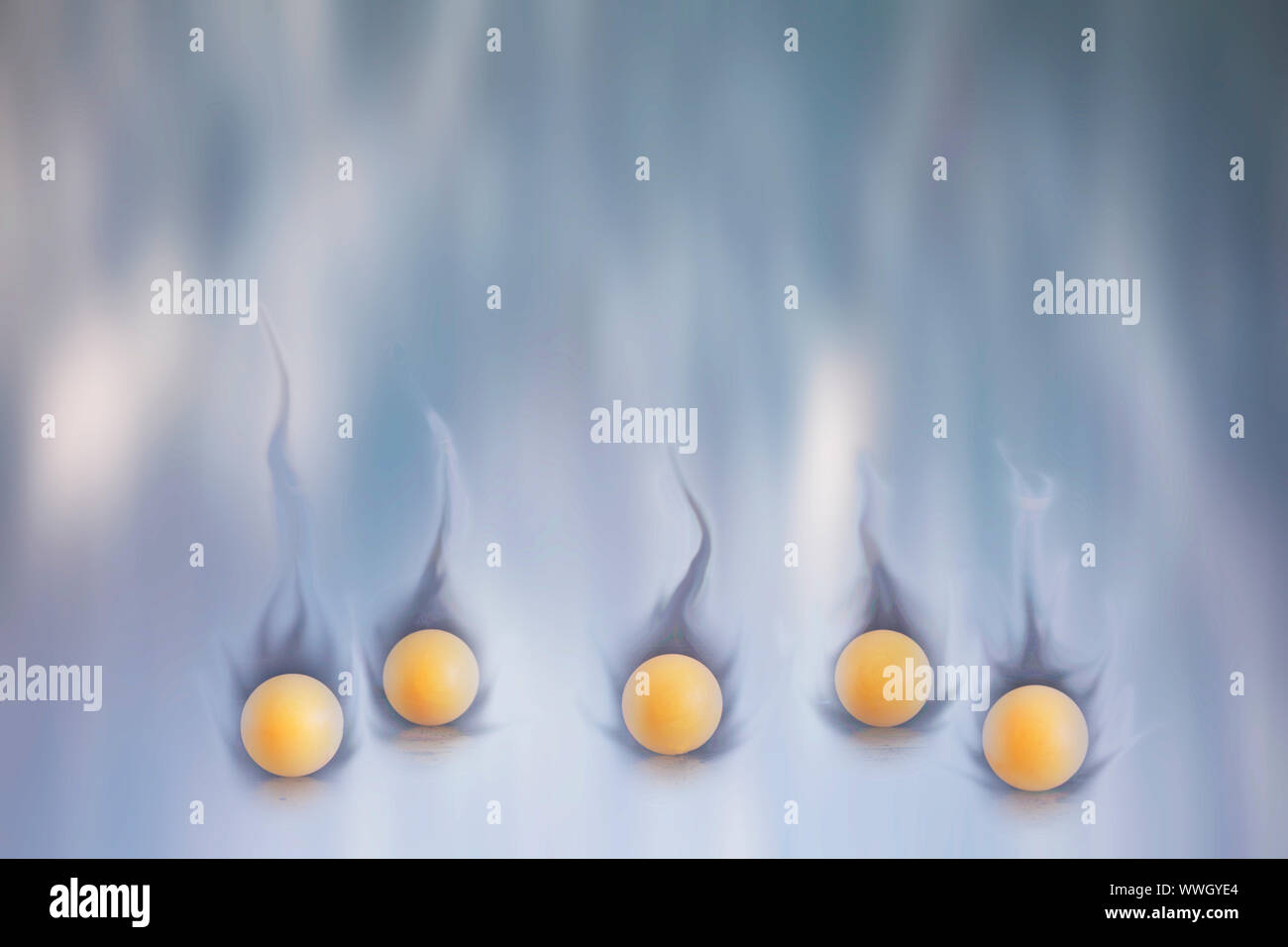 Yellow ball on the move with a trail of beautiful rainbow colors ...