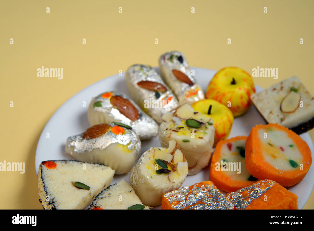 Indian traditional sweets garnished with dry fruits, for celebrating ...