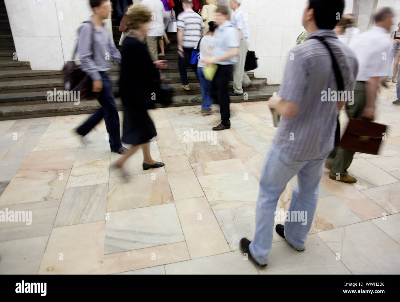 undrground life, all people with defocused and unrecognizable faces ...