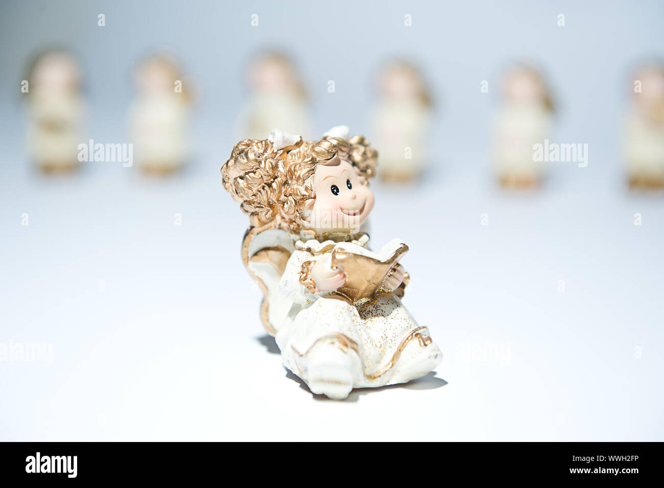 Engel reading from a book. Engels standing in the behind Stock Photo ...