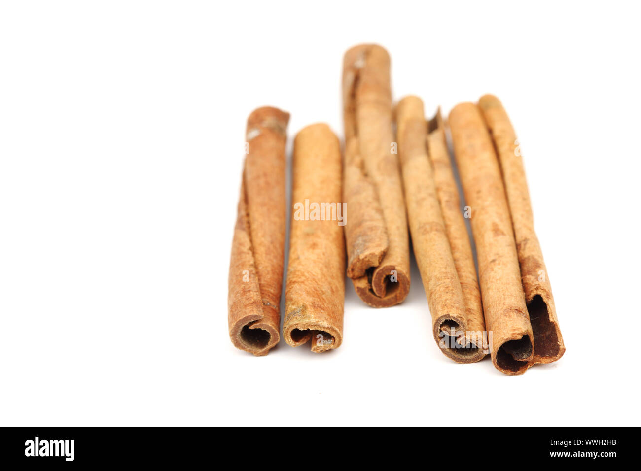 cinnamon pile isolated on white Stock Photo - Alamy