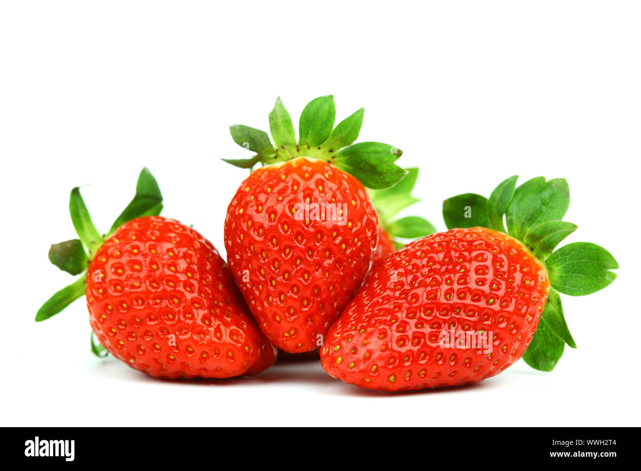 strawberry pile isolated on white background Stock Photo - Alamy
