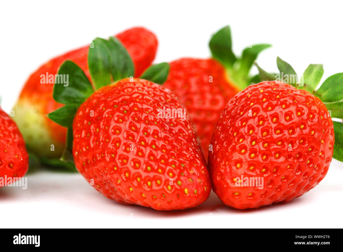 strawberry pile isolated on white background Stock Photo - Alamy