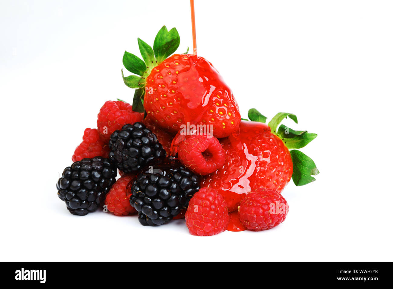 big berry pile in syrup isolated on white Stock Photo - Alamy