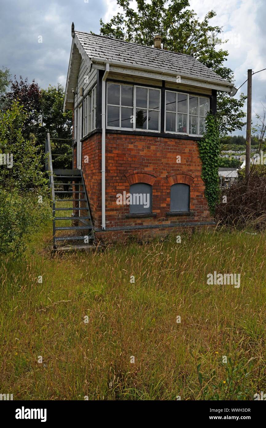 A derelict and overgrown signal box at Foynes station, on the disused ...