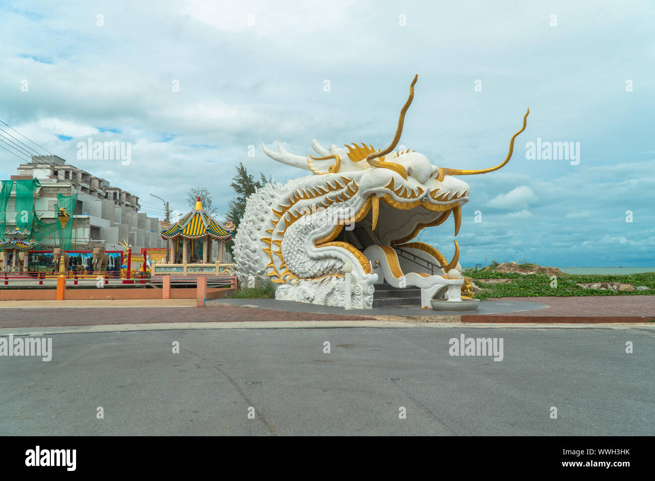 bridge across canal in dragon sculpture at Payoon beach in Rayong ...