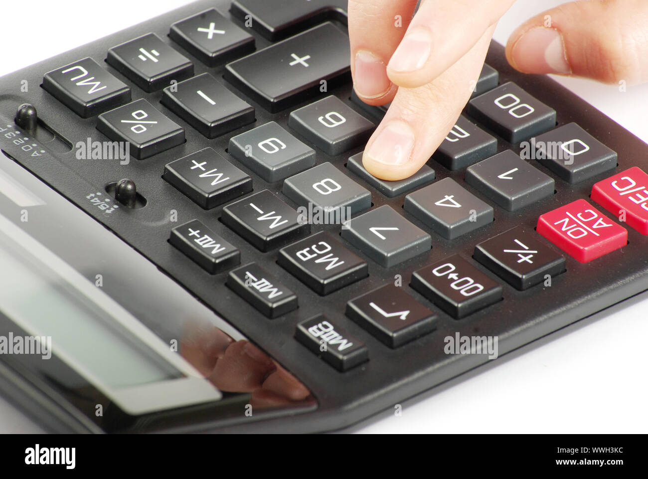 calculator with hand isolated on white Stock Photo - Alamy
