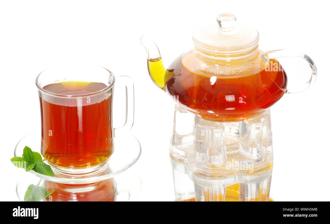 Tea being poured into glass tea cup Stock Photo - Alamy