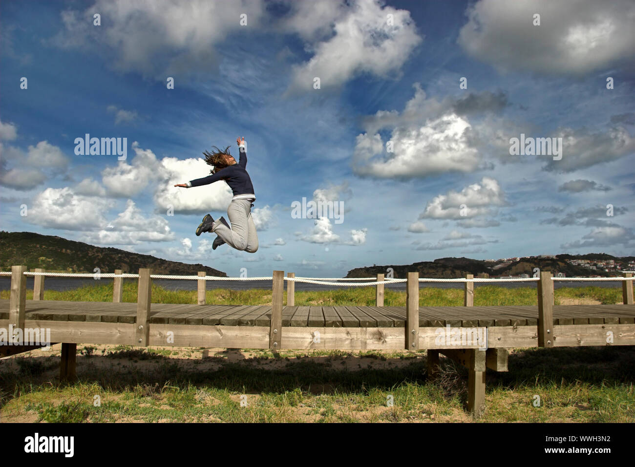 Young woman jumping for fun in a beautiful day Stock Photo - Alamy