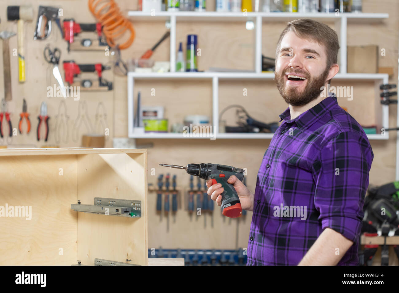 Manufacturing, Small-Sized Companies and worker concept - man working ...