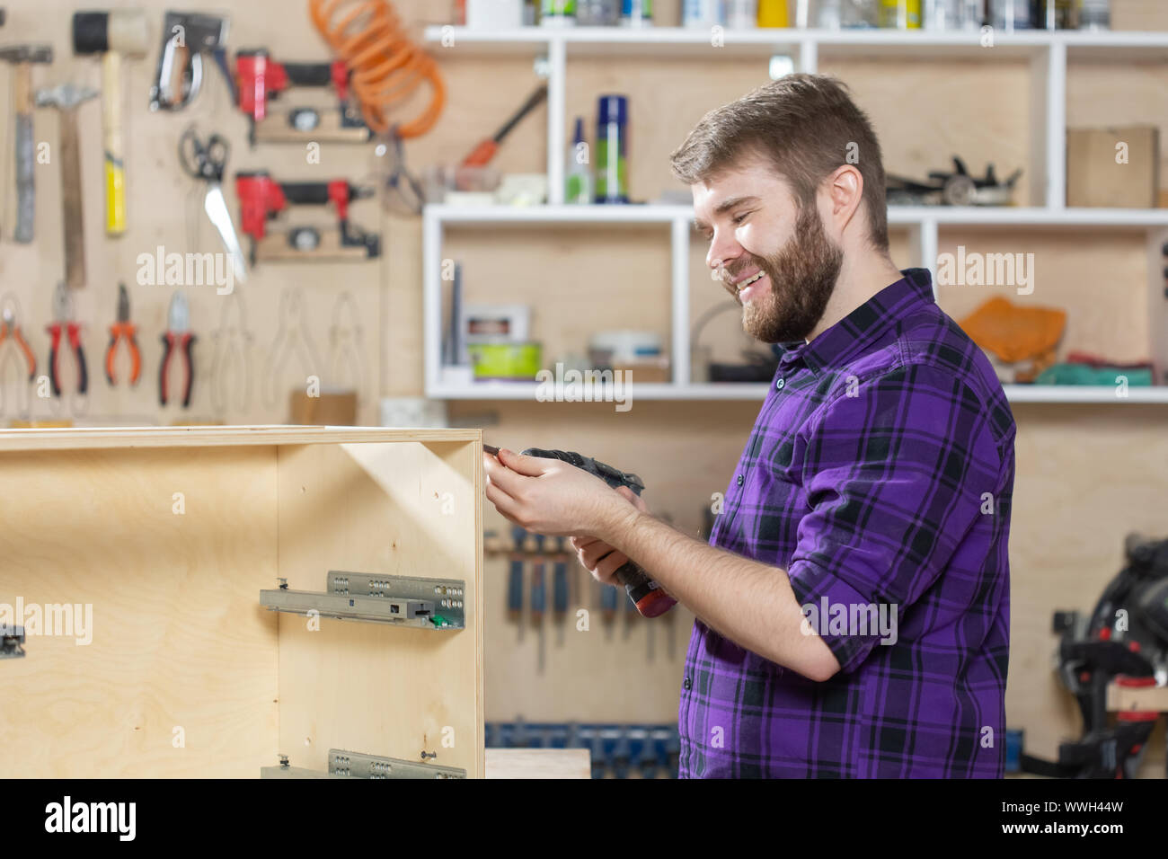 Manufacturing, Small-Sized Companies and worker concept - man working ...