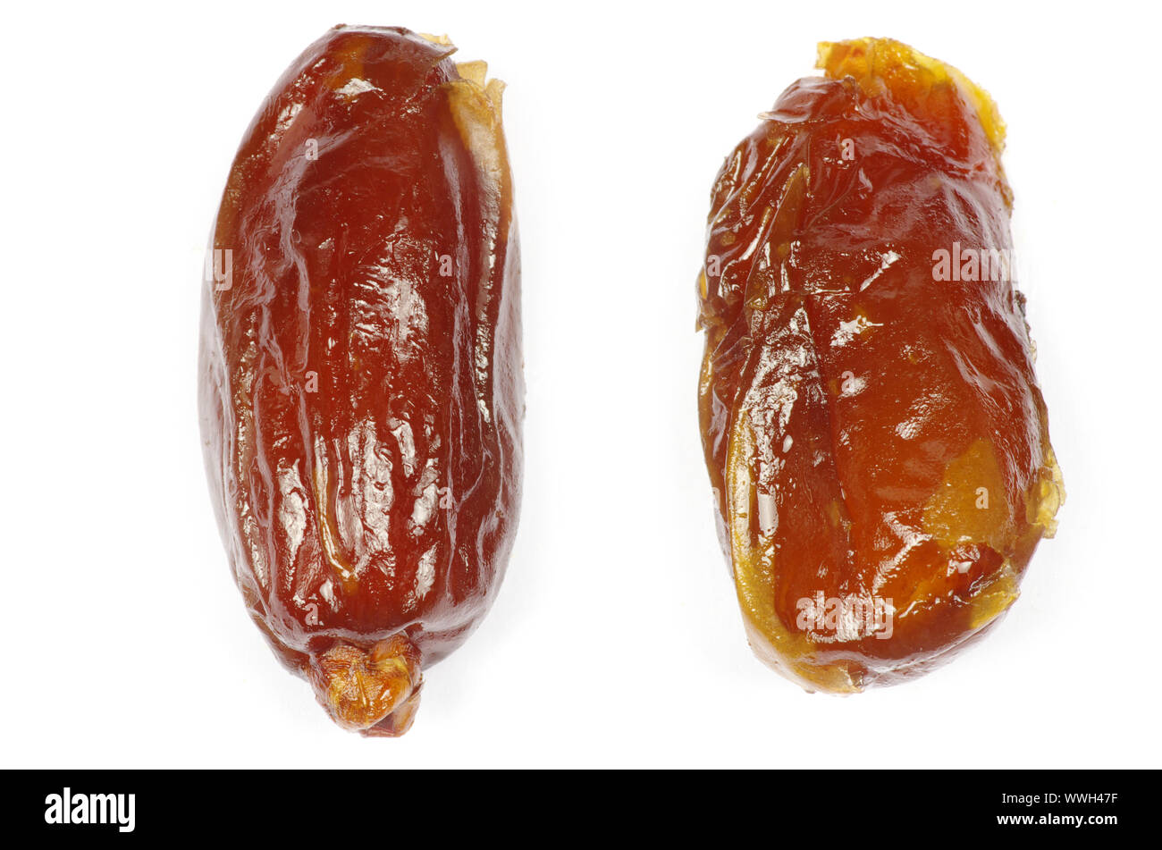 dryed dates on white background Stock Photo - Alamy
