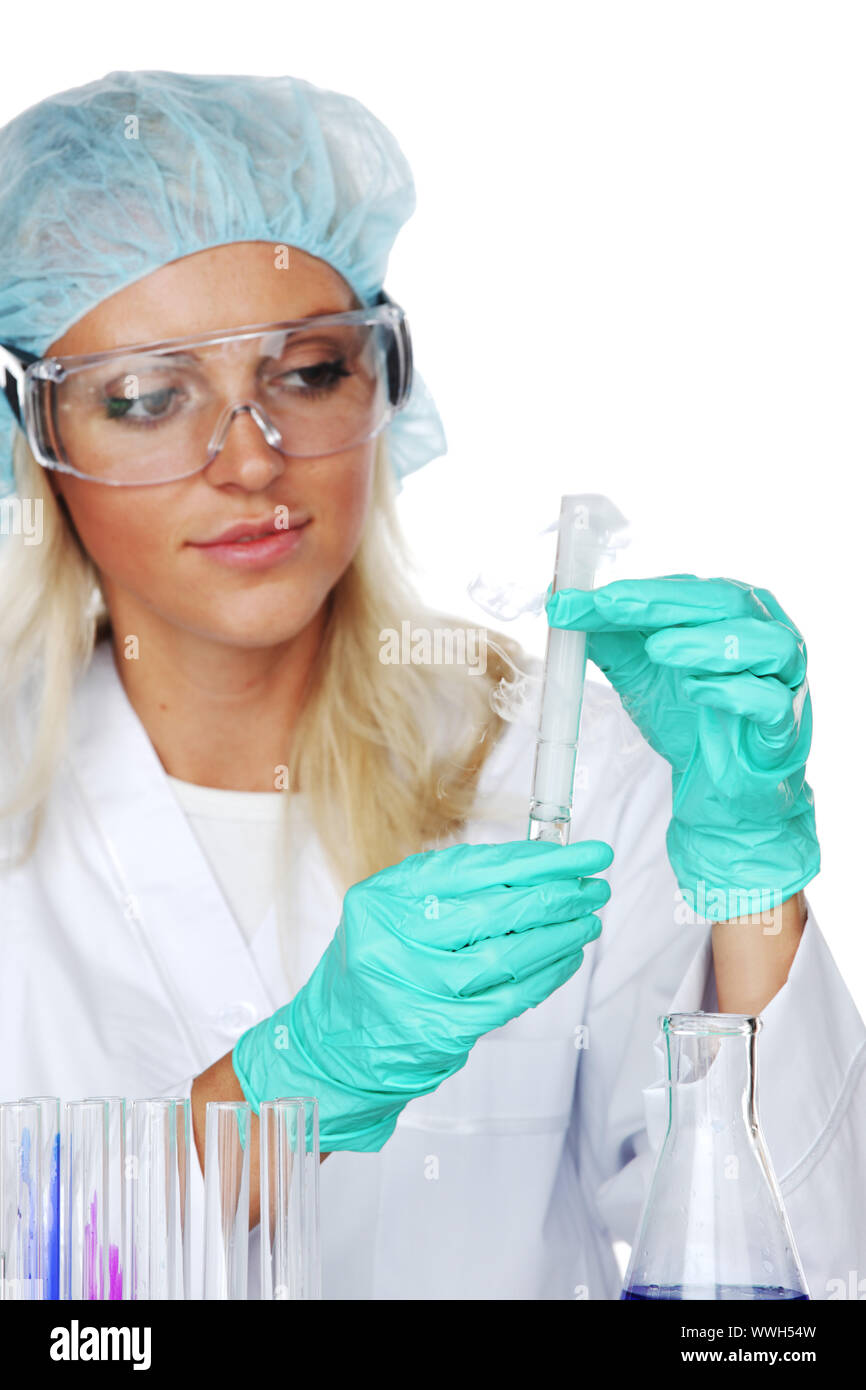 Woman conducting a chemical experiment Stock Photo - Alamy