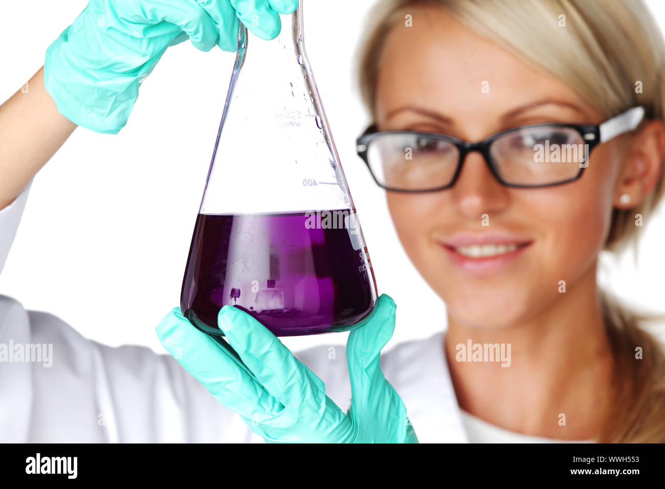 Woman conducting a chemical experiment Stock Photo - Alamy